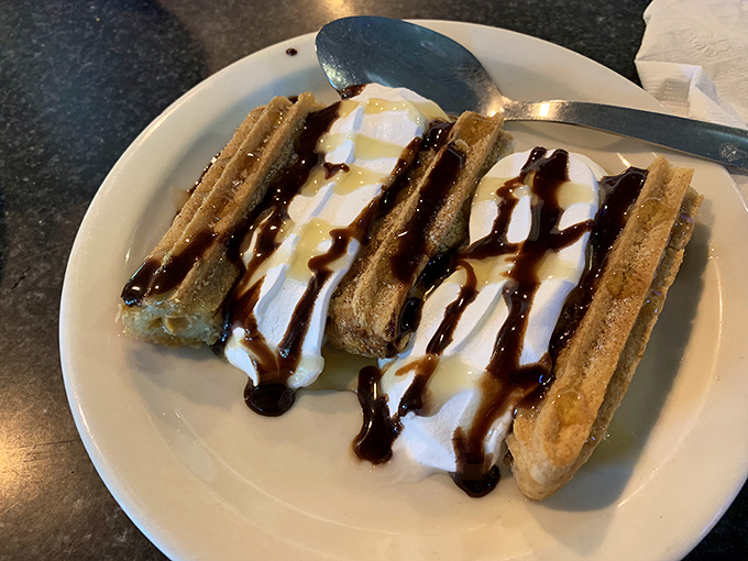 Churros drizzled with chocolate sauce&mdash;proof that the simplest desserts often deliver the most profound happiness.