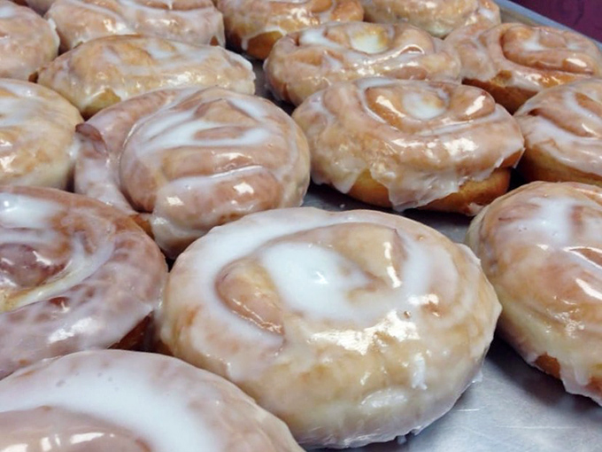 Behold the cinnamon rolls, glistening like they've just stepped out of the spa. Carbs have never looked this good.