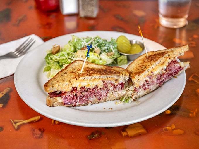 The Reuben sandwich: where corned beef, sauerkraut, and melted cheese create a symphony of flavors that makes you wonder why you'd ever order anything else.
