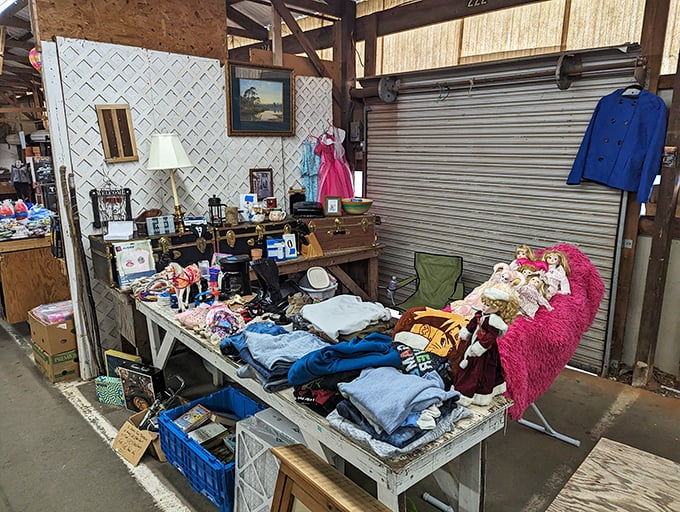 Every item on this table tells a story&mdash;from the neatly folded clothes to the vintage lamp that probably illuminated someone's bedtime reading for decades.