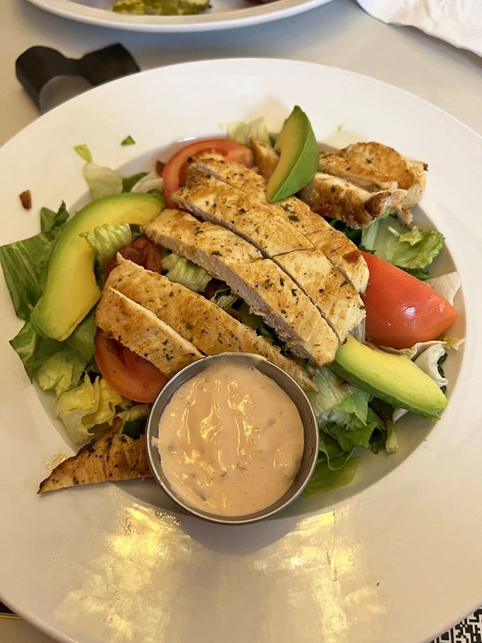 A salad that doesn't apologize for being healthy&mdash;grilled chicken, avocado, and fresh veggies with dressing that means business.