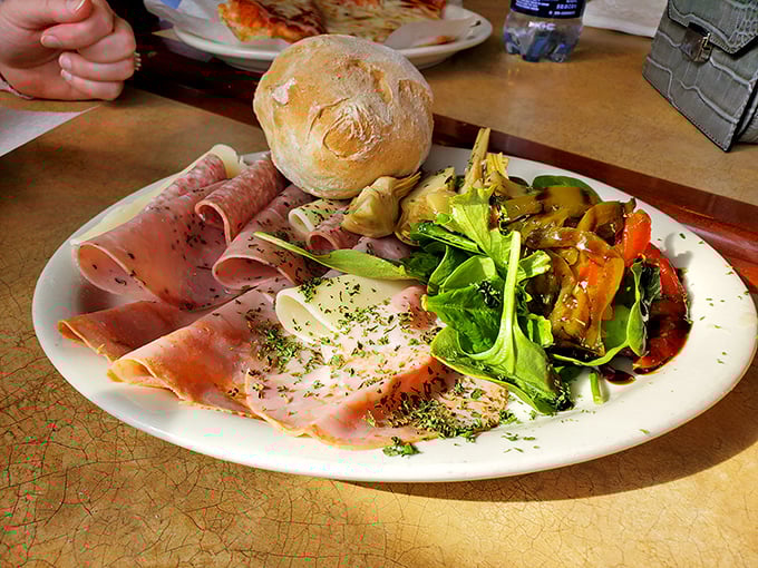 The antipasto plate that launched a thousand sighs. Thinly sliced meats, marinated vegetables, and a crusty roll create the lunch that makes you reconsider your life choices. 