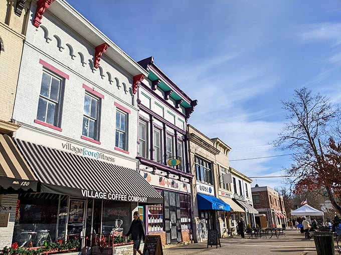 Village Coffee Company anchors this stretch of storefronts where locals exchange news and visitors pretend they're not eavesdropping.