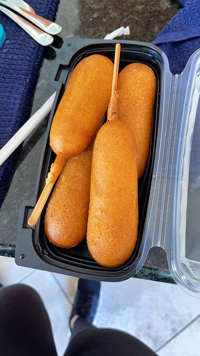 Golden-battered corn dogs standing at attention like delicious sentinels guarding the gateway to comfort food nirvana.