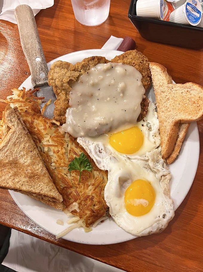 Country fried steak with gravy and sunny-side up eggs—a breakfast so hearty it should come with its own theme song and applause track.