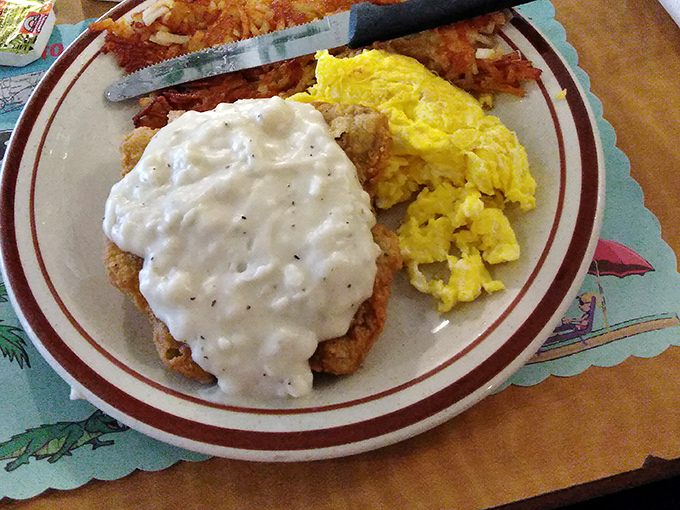 Country fried steak swimming in creamy white gravy &ndash; the breakfast equivalent of a warm hug from your favorite aunt who never learned the meaning of "portion control."