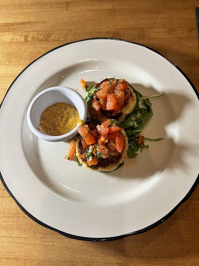 These crab cakes have achieved the impossible: maximum crab, minimum filler, and a presentation that makes you pause before demolishing them.