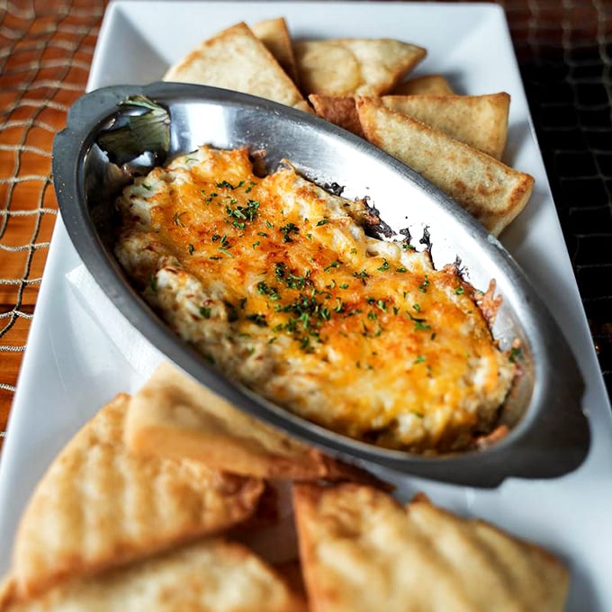Bubbling cheese meets sweet crab meat in this skillet of pure indulgence. The crispy triangles standing guard don't stand a chance against eager dippers.
