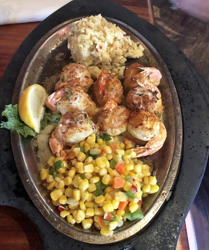 These crab-stuffed shrimp are like the seafood equivalent of Russian nesting dolls&mdash;delicious surprises within delicious surprises, all on a sizzling platter.
