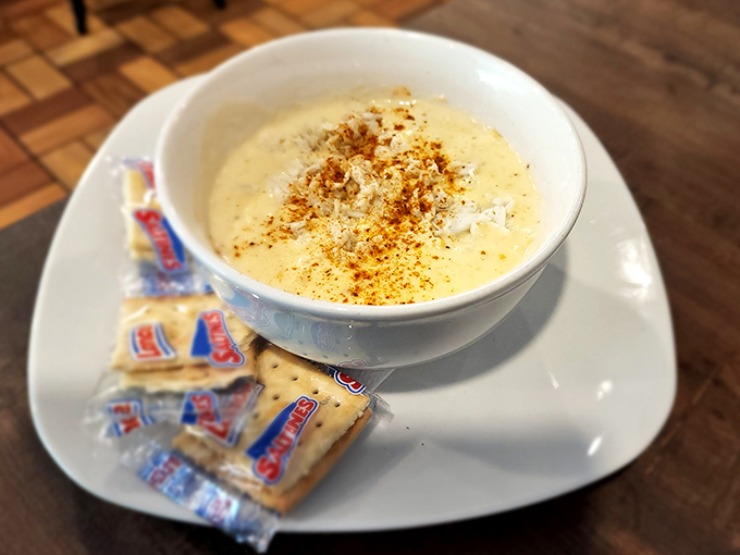 Cream of crab soup that looks like liquid gold in a bowl. Those oyster crackers aren't just garnish&mdash;they're essential texture companions for this velvety delight.