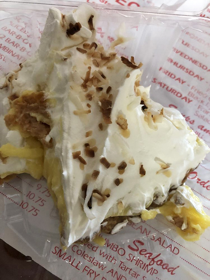 Cream pie that belongs in a dessert hall of fame—cloud-like topping, delicate shavings, and a crust that crumbles just right.