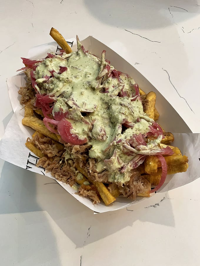 Cuban nachos: where yuca fries meet pulled pork, pickled onions and a sauce that should be bottled and sold nationwide.