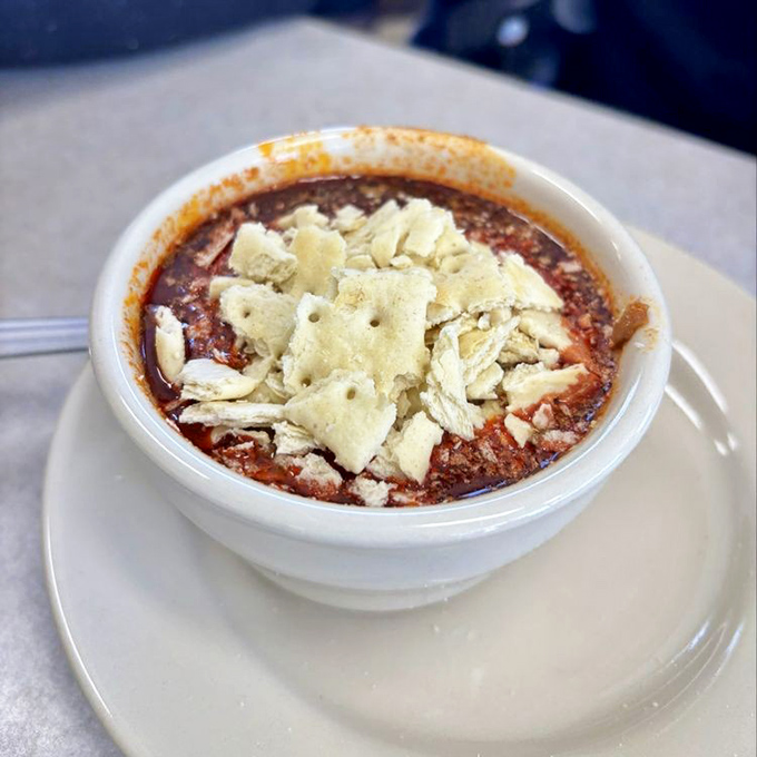 This isn't just chili&mdash;it's a warm hug in a bowl, topped with crackers that dissolve into the savory goodness like snowflakes on a warm sidewalk.