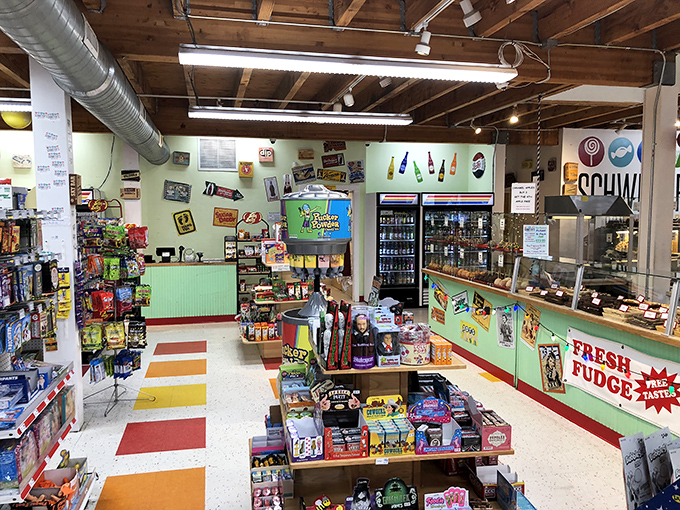 Retro candy signs and a colorful floor create the perfect backdrop for what can only be described as a sugar-induced fever dream.