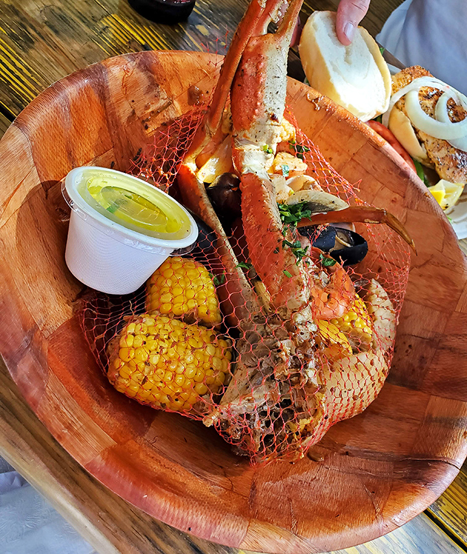 When seafood arrives in a net-lined wooden bowl with corn and drawn butter, you know you've found a place that understands coastal dining perfection.