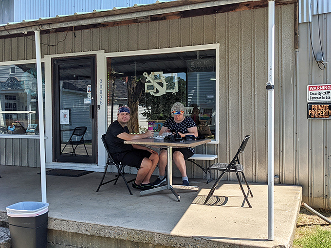 The bakery's simple outdoor seating area offers the perfect spot to savor your multi-layered treasure while watching island life unfold.