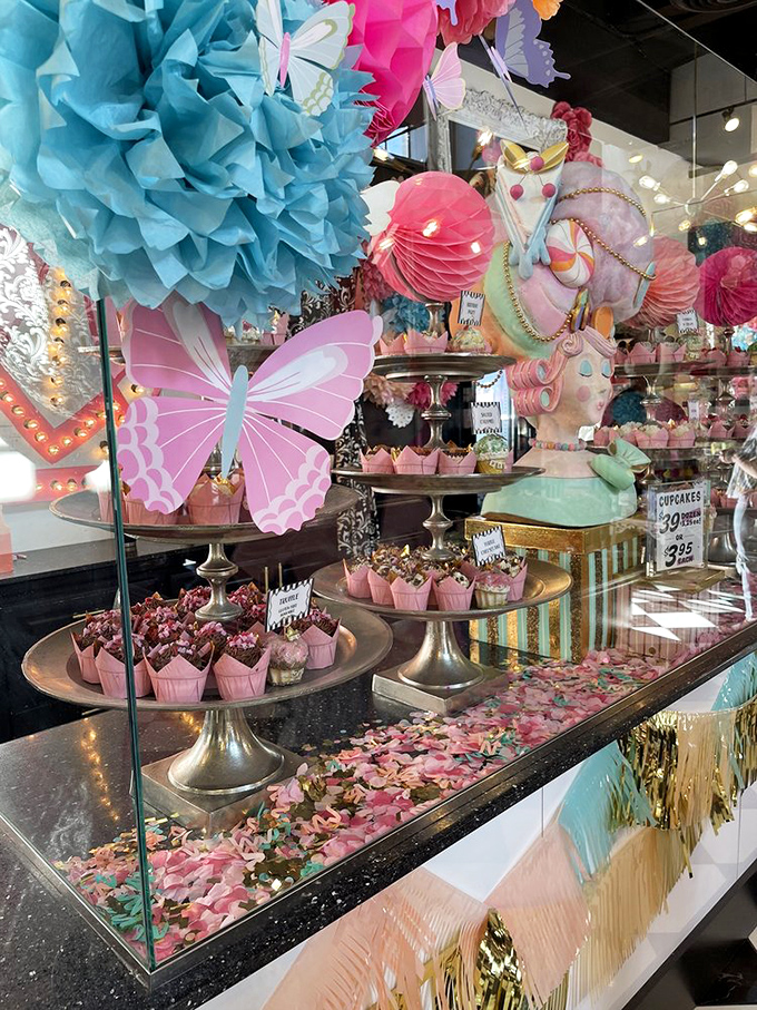 Cupcake pedestals adorned with petals and butterflies—Marie Antoinette would approve of this level of dessert pageantry.