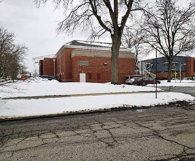 Winter transforms Cleveland Heights into a snow globe scene. This brick building stands stoic against Ohio's elements, like a Midwesterner refusing to admit they're cold.