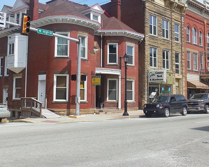 Parallel parking perfected on a street where buildings have watched over daily life since horse-and-buggy days. History with convenient metered spaces. 
