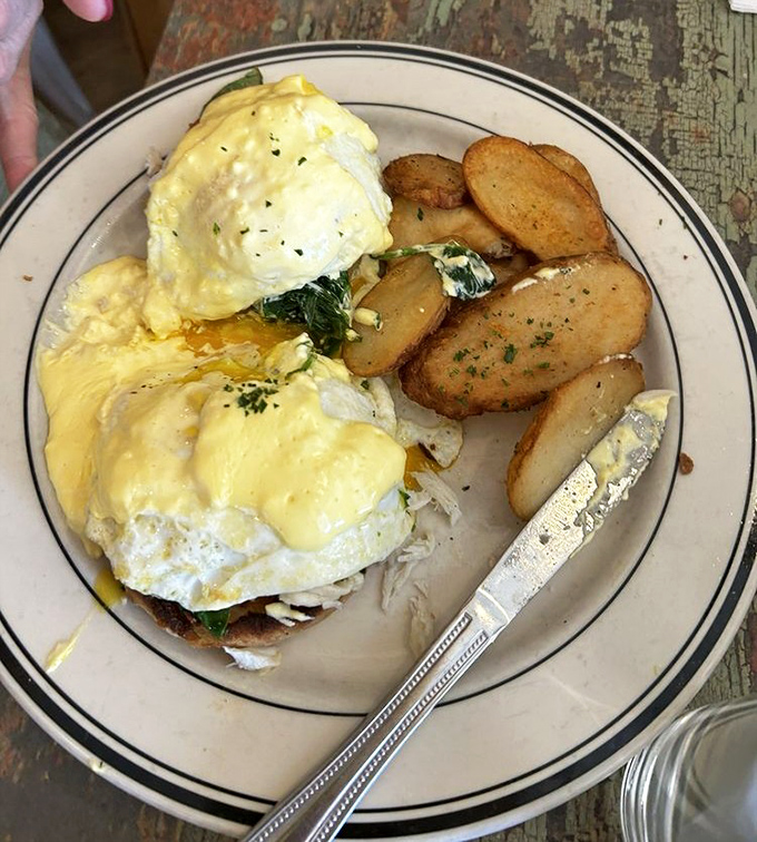 Eggs Benedict elevated with perfectly poached eggs and a biscuit foundation. Hollandaise sauce that could make a grown adult weep with joy.
