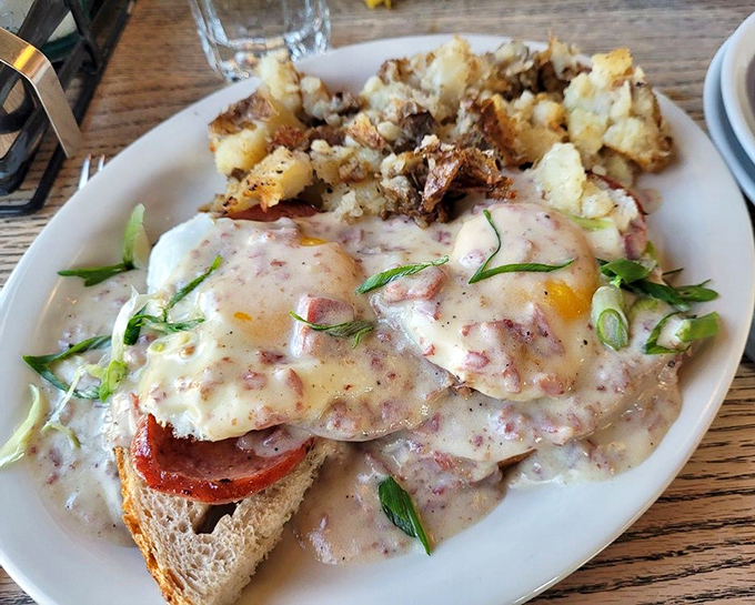 Eggs Benedict reimagined with enough sauce to make you consider drinking it straight. Pure breakfast decadence on toast.