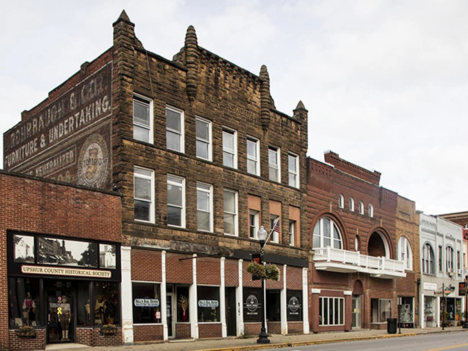 Downtown's historic buildings tell stories in brick and mortar. That "Furniture & Undertaking" sign suggests a time when one-stop shopping had different priorities.