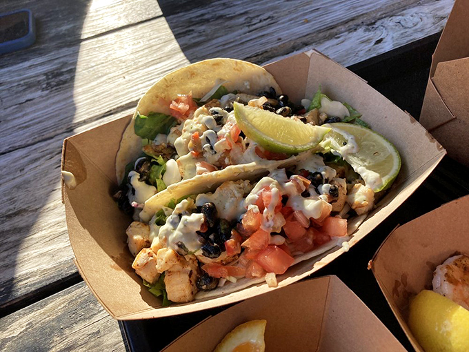 Not just tacos&mdash;they're seafood celebrations wrapped in tortillas. Black beans, fresh shrimp, and that lime wedge standing by for its moment of glory. 