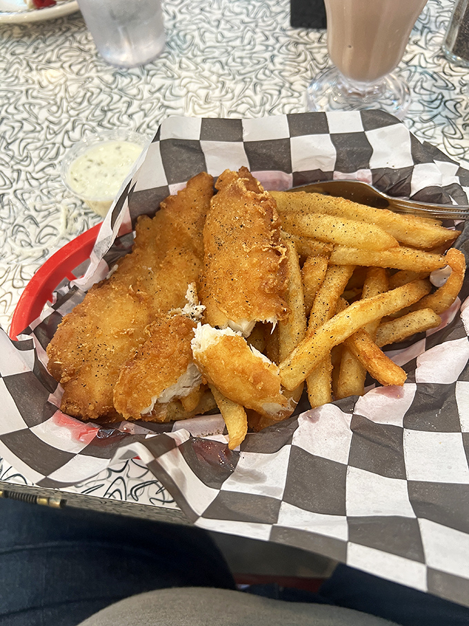 Fish and chips that would make the British jealous&mdash;crispy, golden batter protecting flaky white fish, with fries that deserve their own fan club.