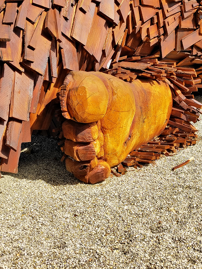 A hand that could palm a beach ball or gently turn the pages of 'Sasquatch Monthly.' The craftsmanship makes you forget you're looking at lumber.