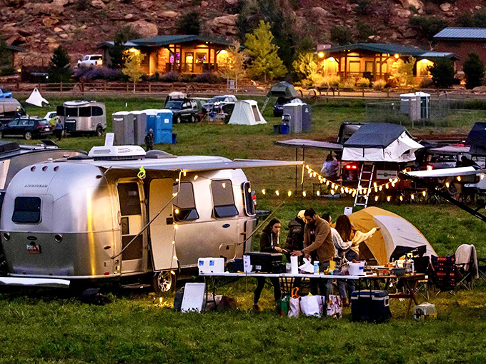 Airstream dreams under desert skies. This gathering of silver bullets and string lights creates the perfect nomadic neighborhood for stargazing socialites.
