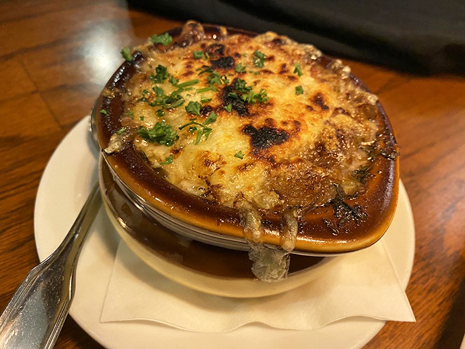 French onion soup that's wearing a bronzed cheese hat and isn't shy about it. Comfort food that's dressed for a fancy night out.