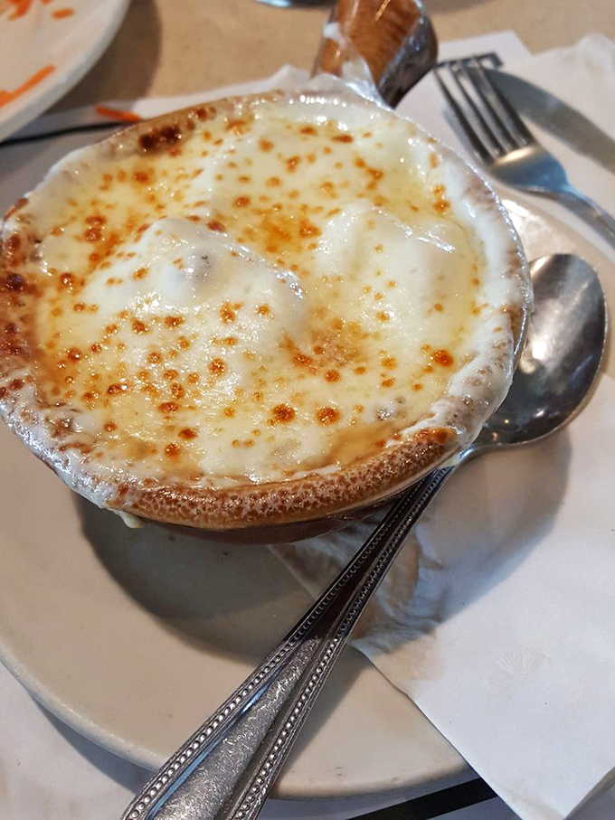 This isn't just French onion soup&mdash;it's a cheese-crowned miracle in a crock. The perfect balance of sweet onions, savory broth, and that glorious broiled cheese cap.