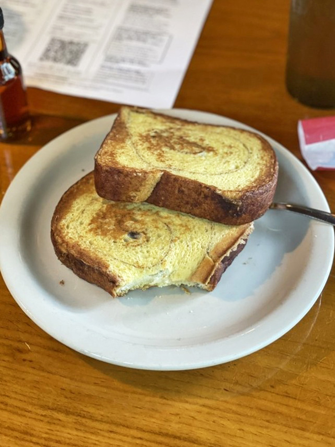 French toast that makes ordinary bread feel inadequate. Golden, egg-soaked perfection that's been to culinary finishing school and graduated with honors.