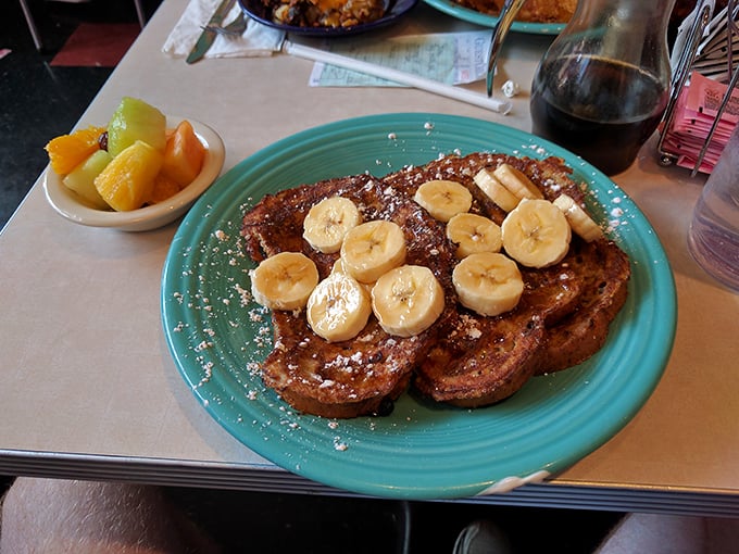 French toast that makes you question every other breakfast decision you've ever made. Those bananas aren't garnish&mdash;they're essential supporting actors.