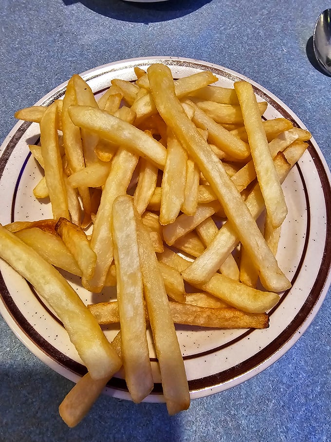 French fries so perfectly golden they deserve their own retirement plan. Crispy on the outside, fluffy within&mdash;life's simple pleasures.