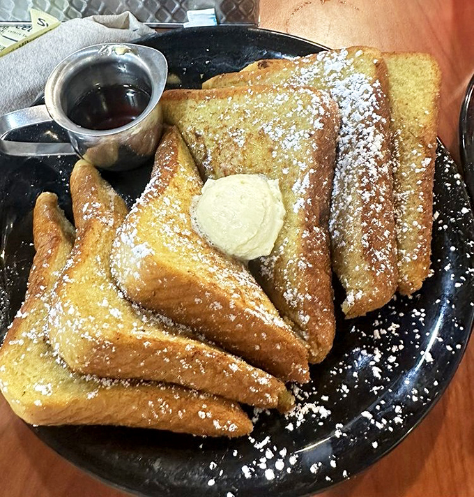 French toast that makes you question why the French don't talk about this more often. Golden, powdered-sugar dusted slices that deserve their own passport.