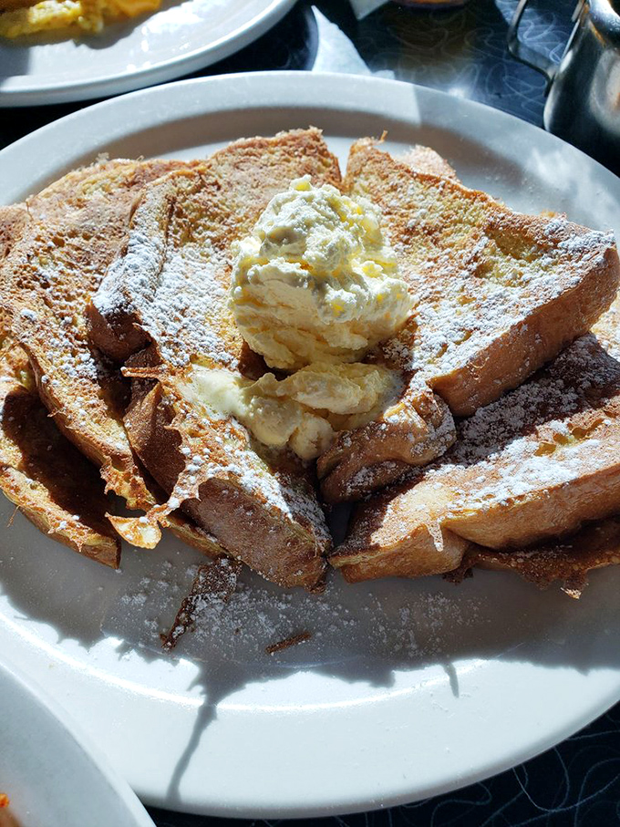 French toast that transforms humble bread into a powdered sugar masterpiece&mdash;proof that breakfast can indeed be dessert.