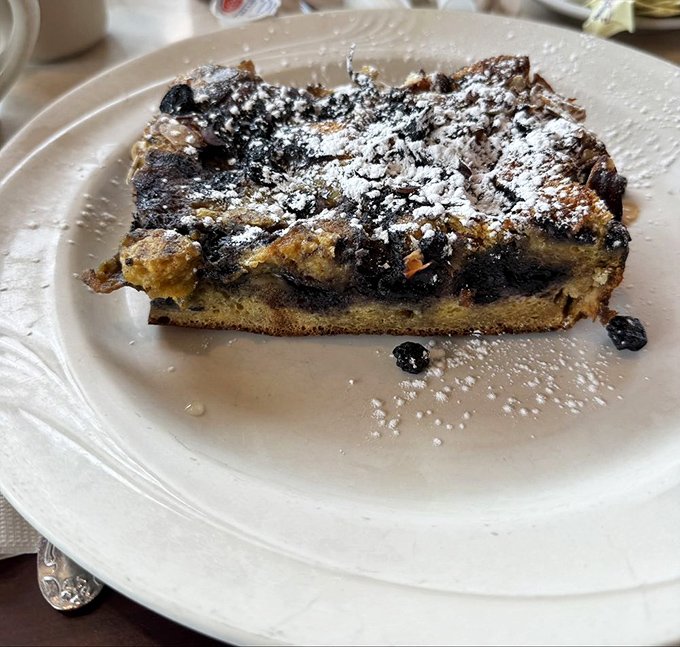 This isn't just French toast &ndash; it's a sweet masterpiece studded with blueberries and dusted with powdered sugar. Breakfast or dessert? Why choose when you can have both?