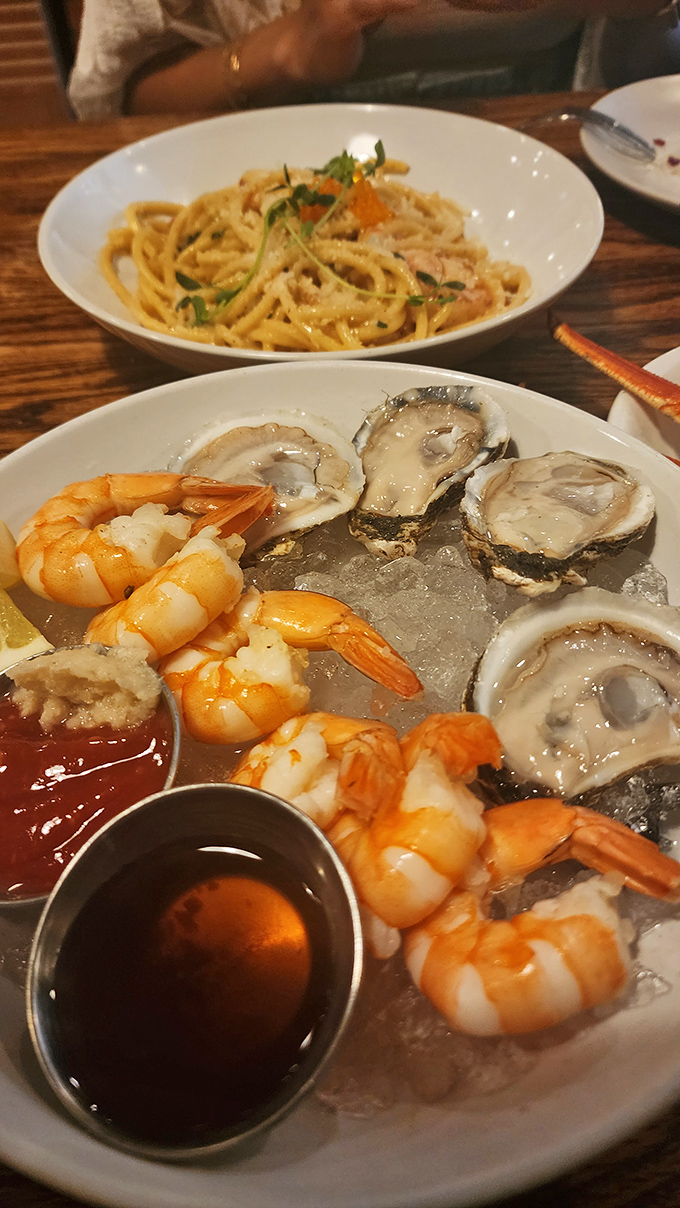 The seafood tower that makes you question why you live so far from an ocean. Fresh oysters and shrimp lounging on ice like celebrities.