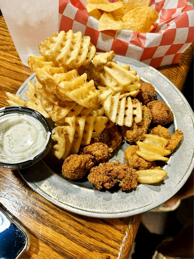 Golden-fried treasures from the sea paired with waffle fries&mdash;a plate that makes you want to high-five the chef.