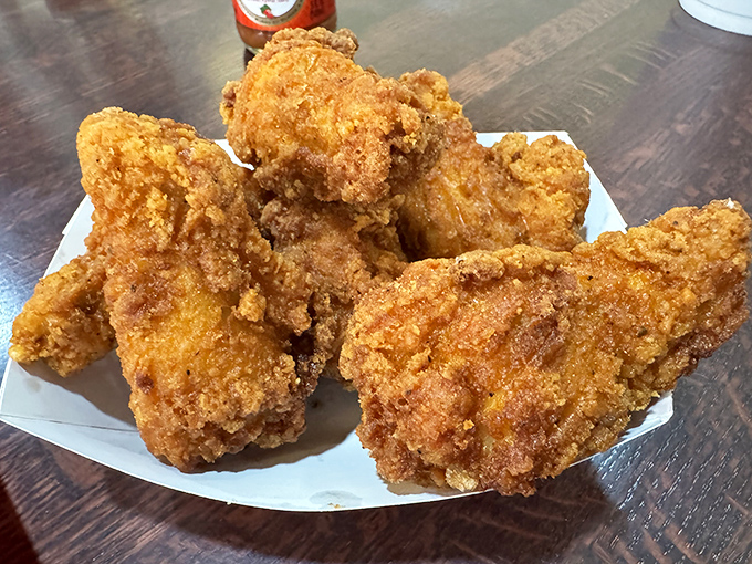 Golden-brown perfection that makes that national chain's "secret recipe" look like amateur hour. The crunch is audible three tables away.