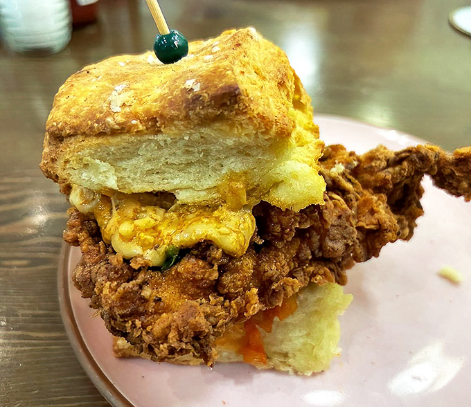A fried chicken biscuit sandwich that makes you understand why Southerners have been keeping this breakfast secret from the rest of us for generations.