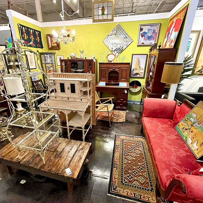 A yellow accent wall creates the perfect backdrop for this eclectic vignette where vintage meets vibrant in a dance of design possibilities.