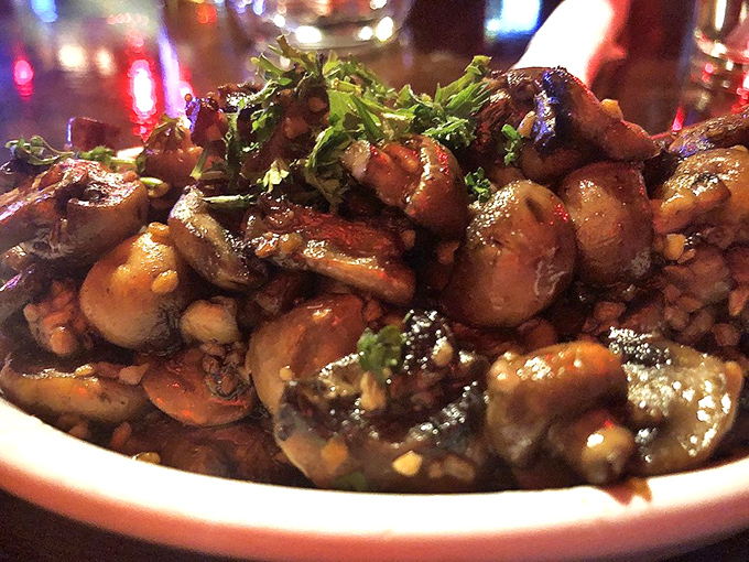 Garlic mushrooms glistening with buttery goodness. Whoever said British food lacks flavor clearly never encountered these little umami bombs of joy.
