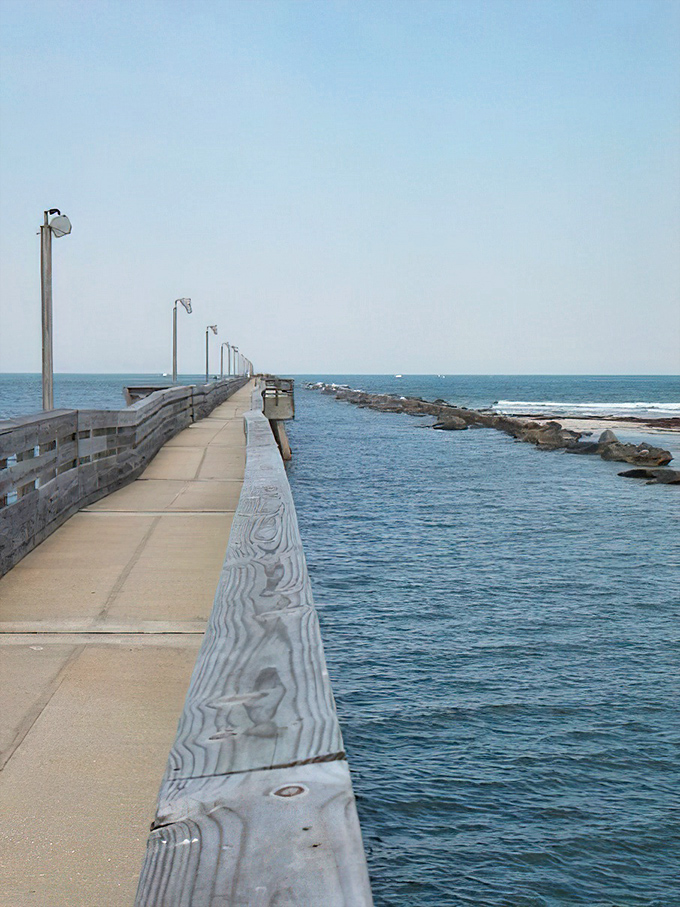 This fishing pier stretches toward the horizon like a runway for dreams, inviting both serious anglers and sunset photographers.