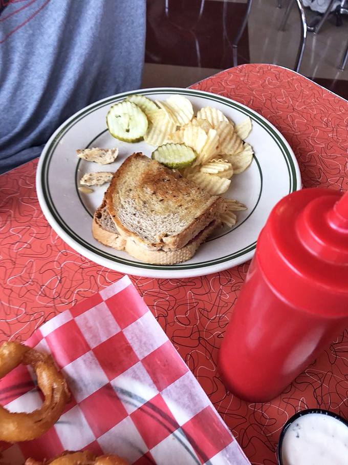 A sandwich so honest it doesn't need fancy descriptions. Chips, pickles, and that classic red-checkered paper&mdash;this is America on a plate, no passport required.