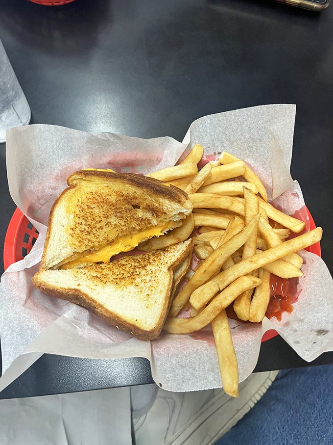 The humble grilled cheese, elevated to art form. That golden-brown exterior promises the gooey treasure within&mdash;comfort on a plate.