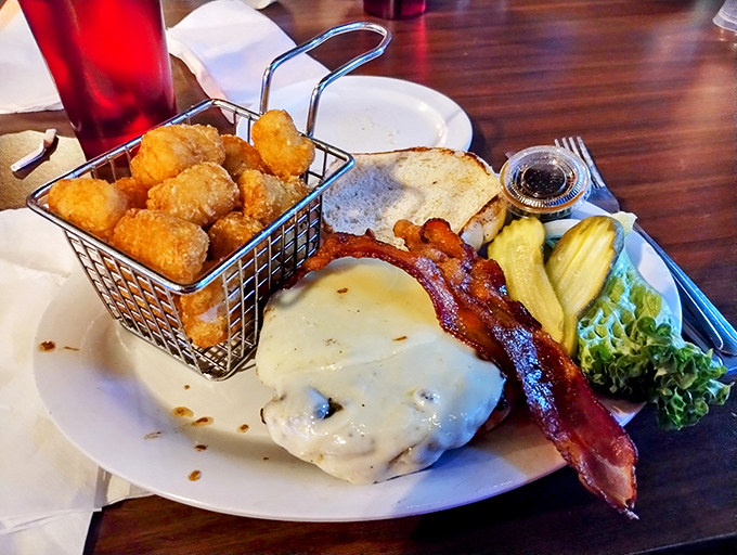 A burger that defies gravity and common sense. Those layers of melty cheese, bacon, and beef create a tower of power that demands respect.