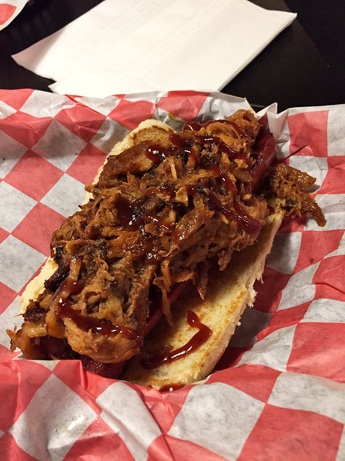 This isn't just a hot dog&mdash;it's a meat symphony where pulled pork plays first chair. The sauce adds that perfect sweet-tangy crescendo.