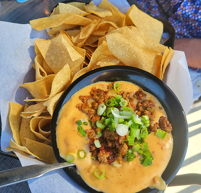 This queso dip isn't just melted cheese&mdash;it's a warm, spicy hug in a bowl with seasoned beef playing the role of unexpected hero.